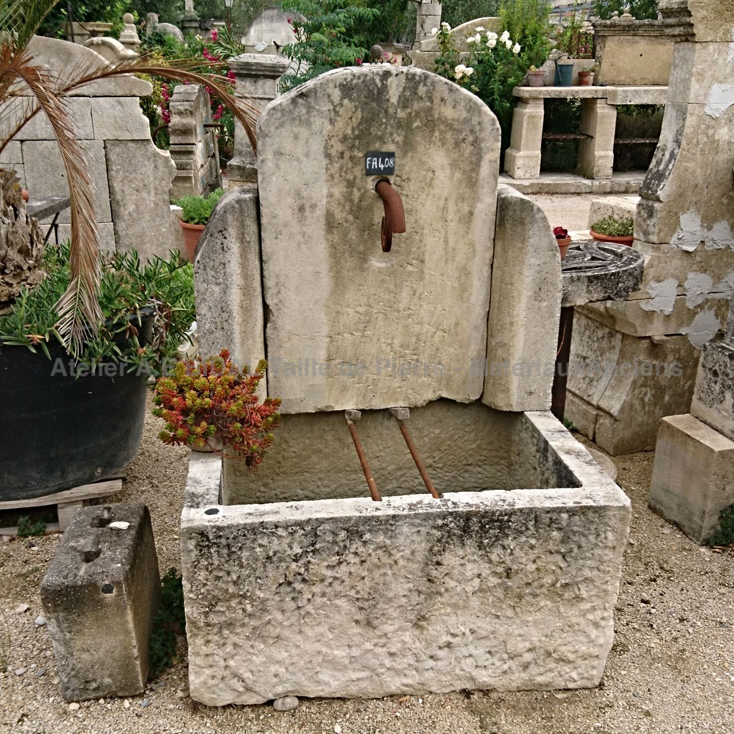 Small fountain - wall fountain made of stone, wrought iron and metal.