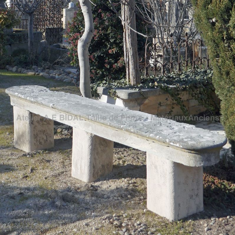 Garden bench in old stones : long antique stone bench