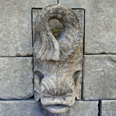 Wall fountain with half-moon basin and beautiful hand sculpted dolphin