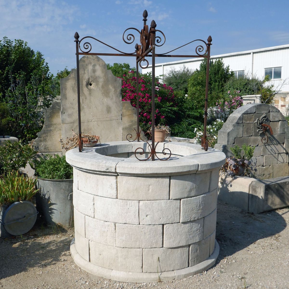 Limestone round garden well with wrought iron top | Garden decoration