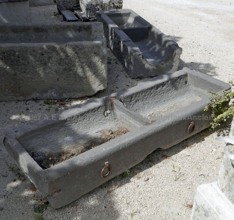 Long rectangular stone trough - old trough made of lava stone.