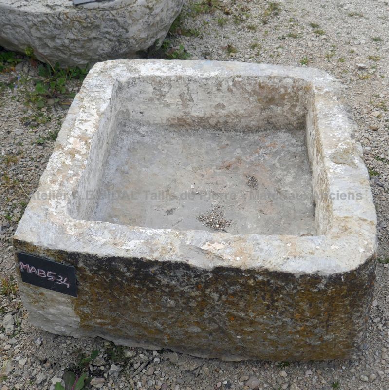 Rustic-looking small trough in stone - shallow rectangular trough