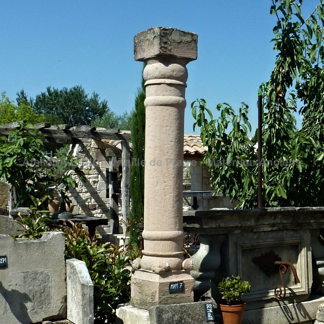 Old pillar - an old stone pillar with base and top.