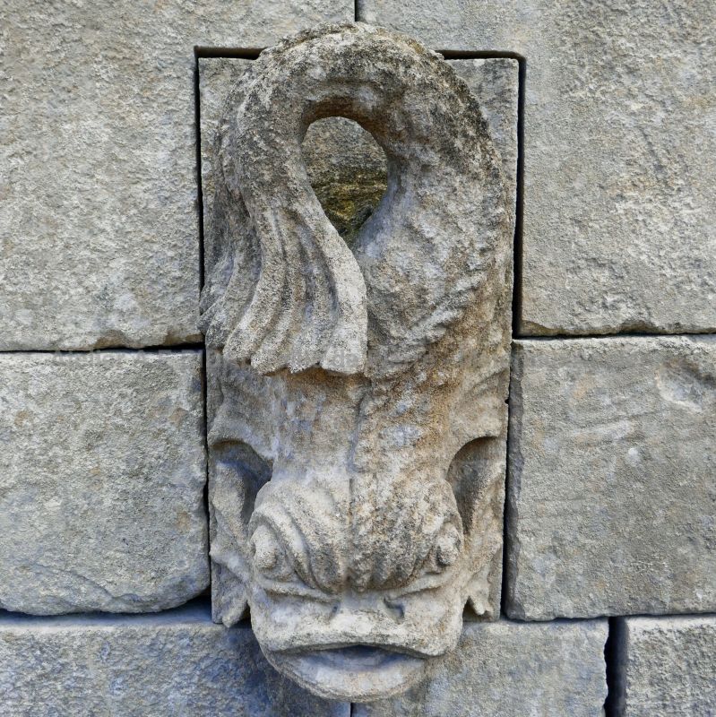 Wall fountain with half-moon basin and beautiful hand sculpted dolphin