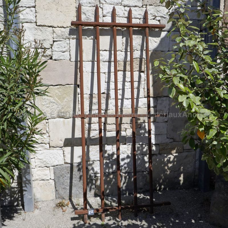 Beautiful old grid - an old openwork grid made of wrought iron.