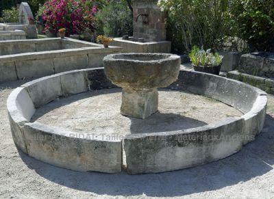 Large rustic basin in old stones for outdoor landscaping