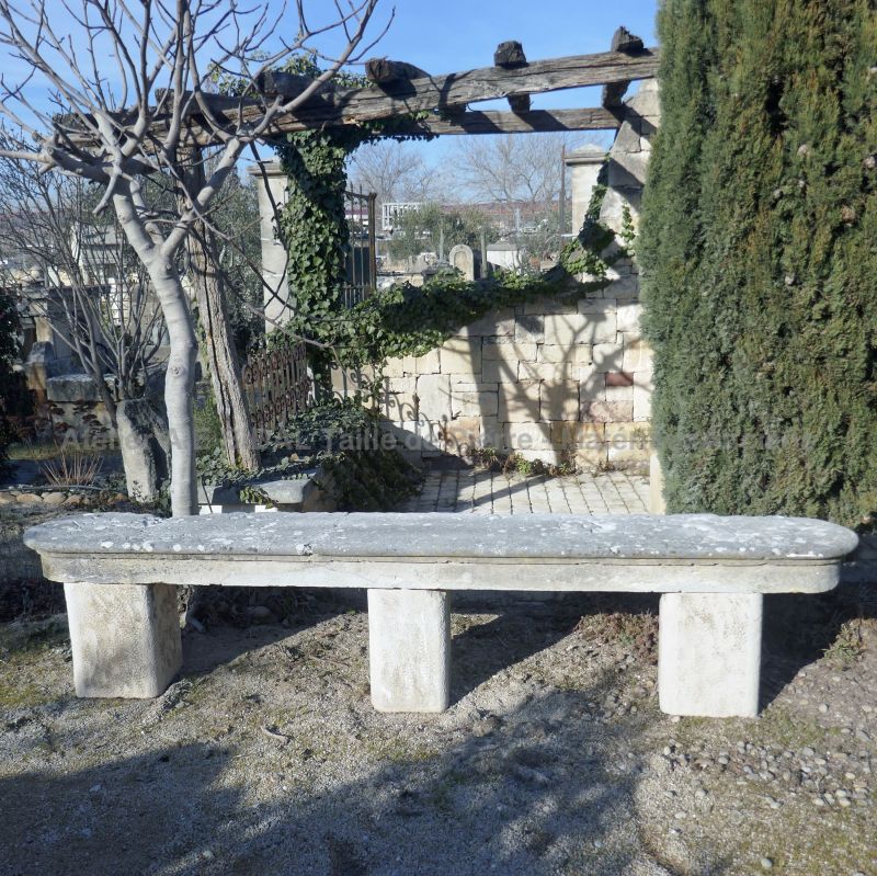 Garden bench in old stones : long antique stone bench