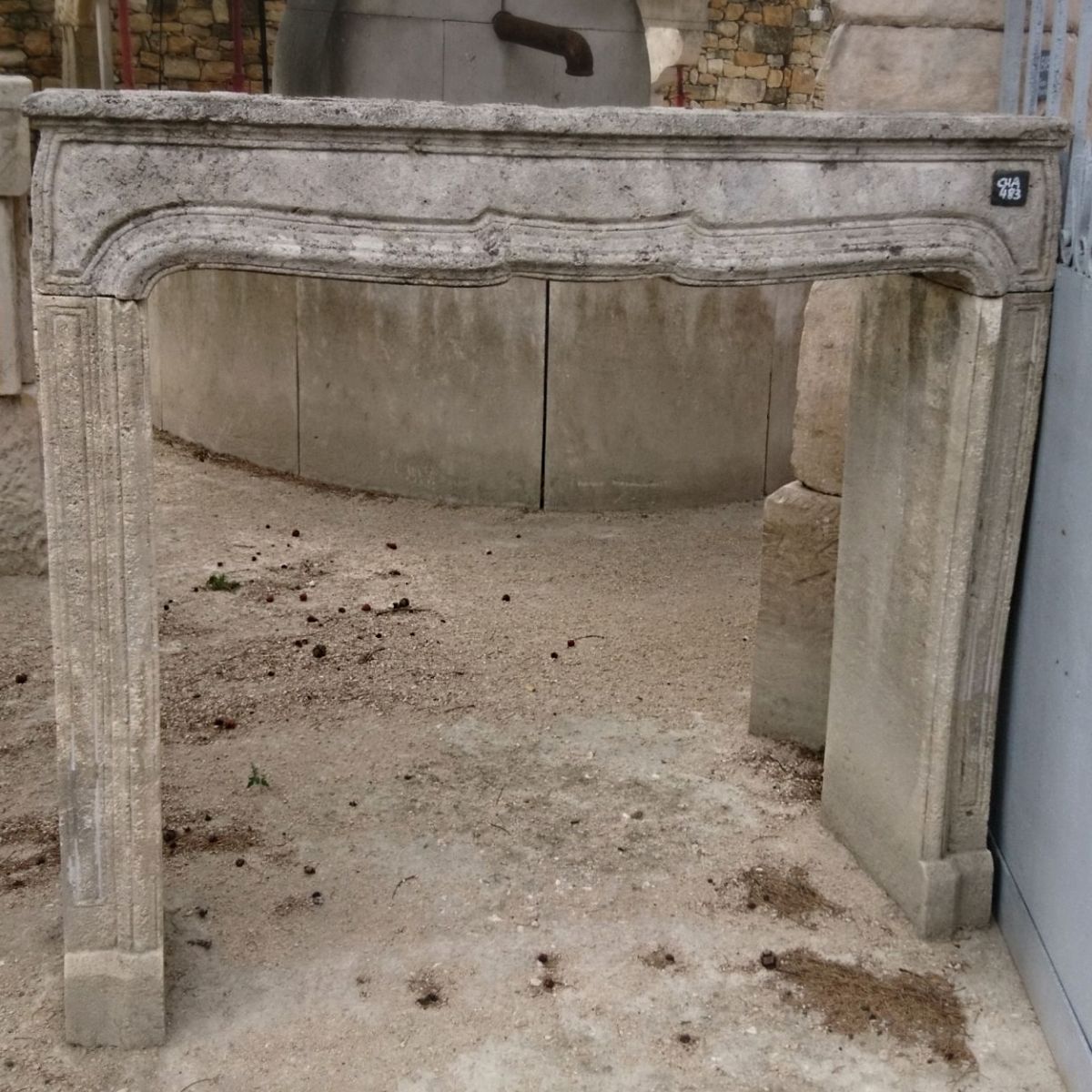 Antique mantle in stone - A small Louis 15 fireplace in stone.