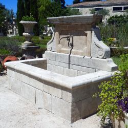 Wall fountain with half-moon basin and beautiful hand sculpted dolphin