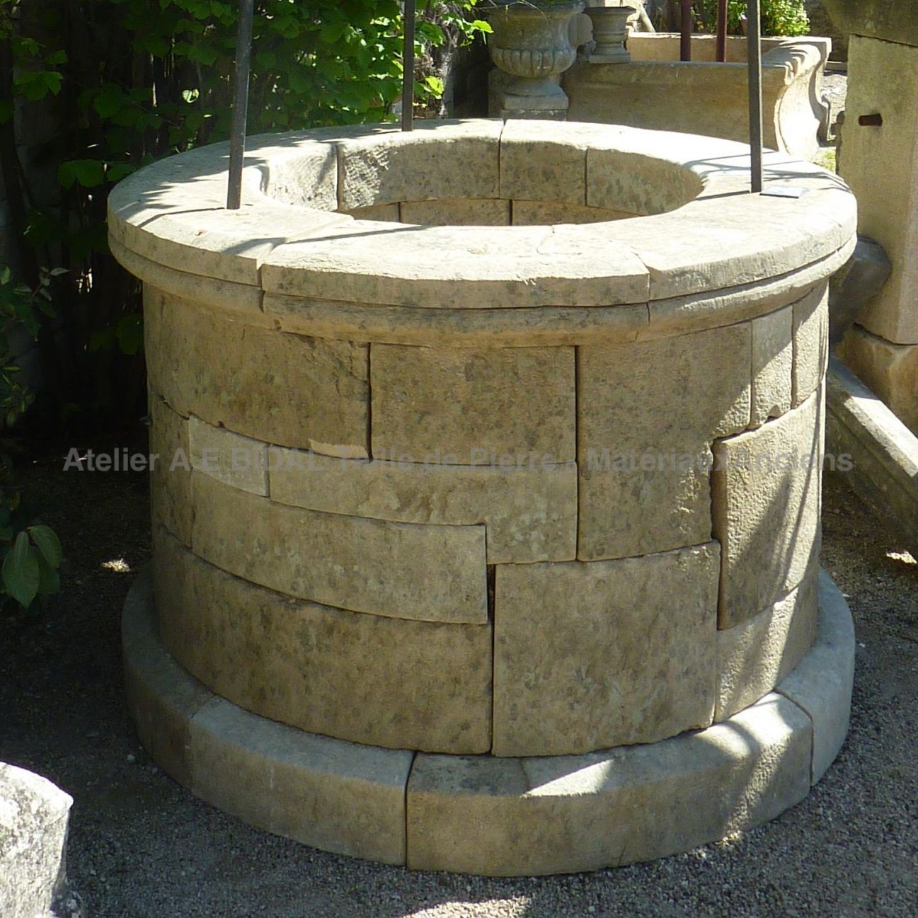 Round well with top. Set of wells made of old materials.