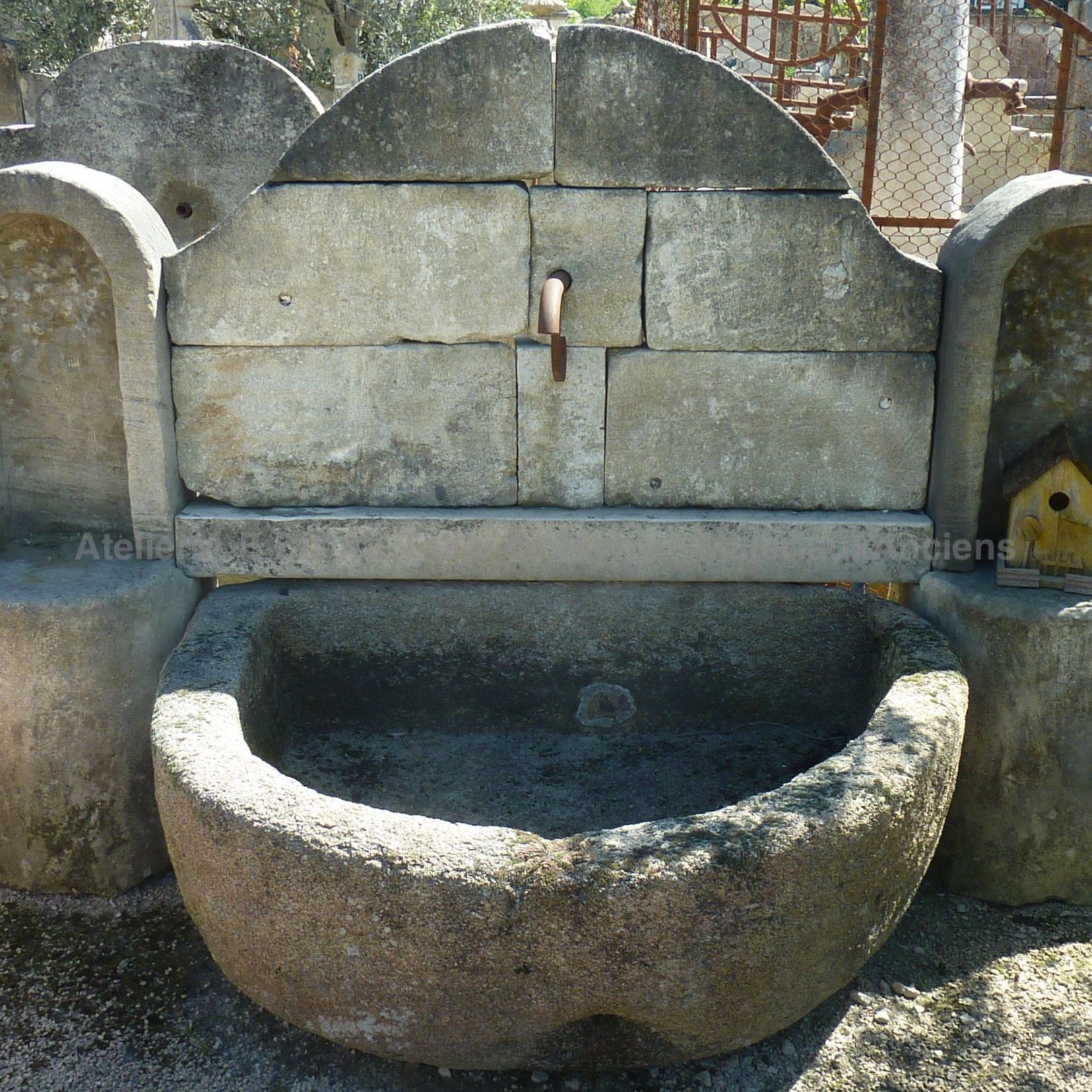 Garden fountain with broad and massive pan - beautiful wall fountain.