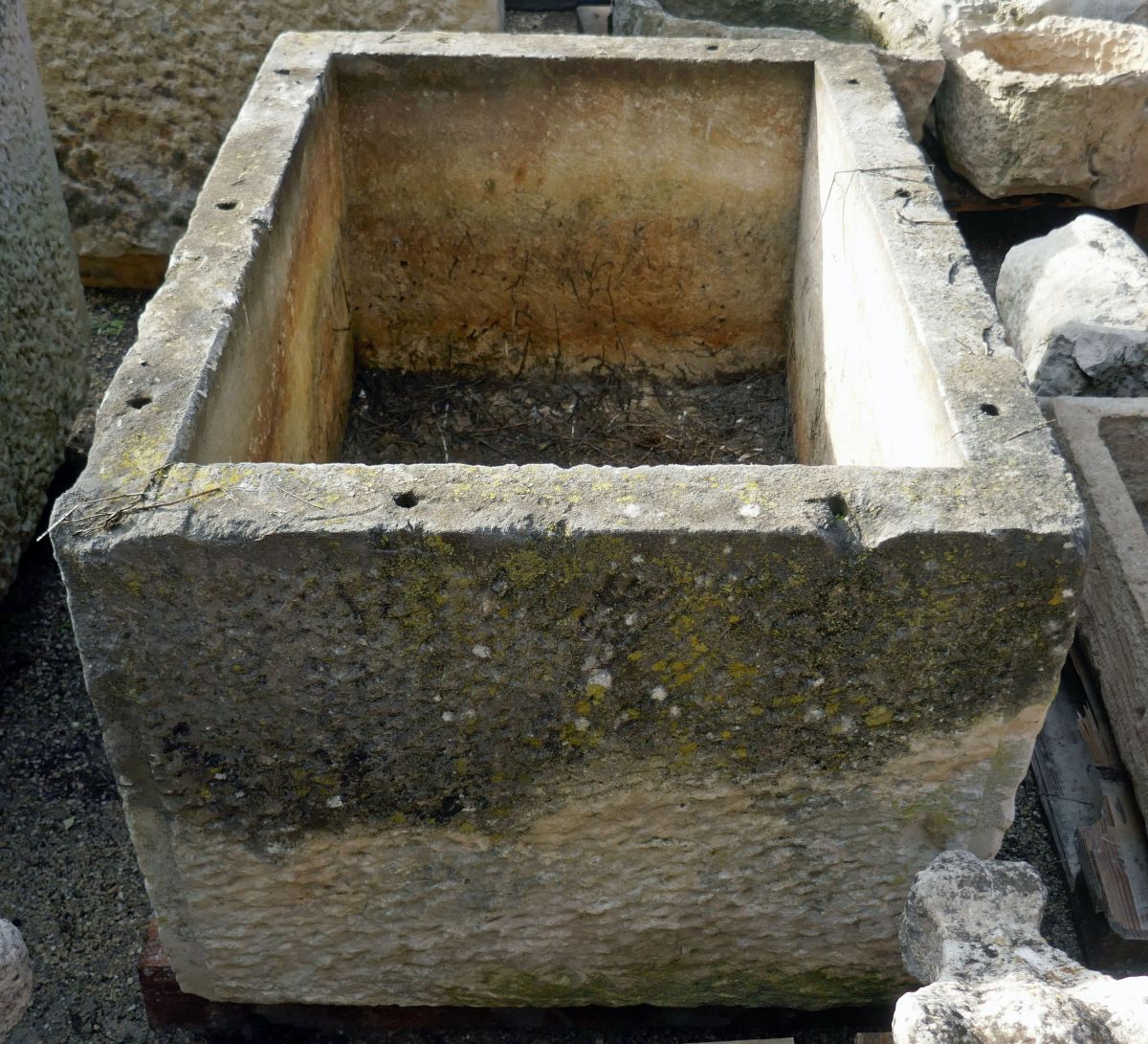 Old stone trough for sale at Alain Bidal Antique Materials in Provence
