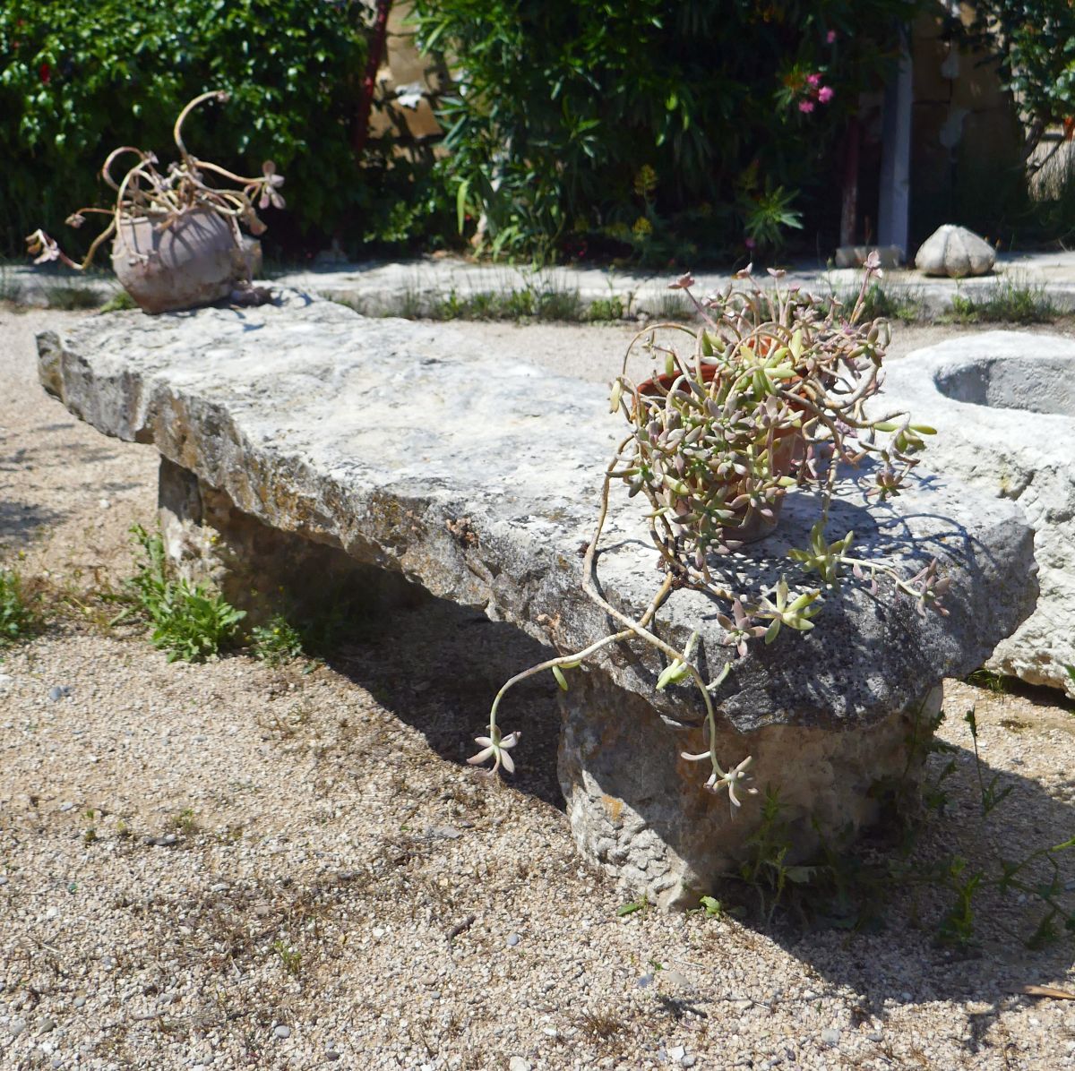 Real antique stone bench with 2 legs | Old garden furniture in stone