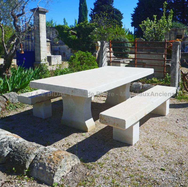 Sturdy garden furniture : long massive table and two benches in stone