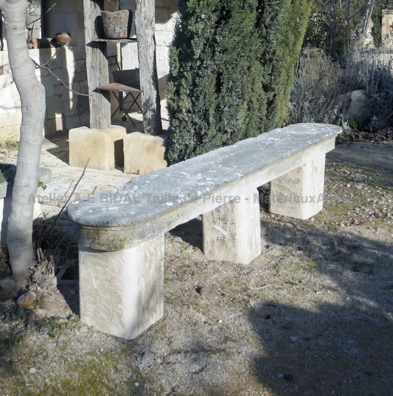 Garden bench in old stones : long antique stone bench