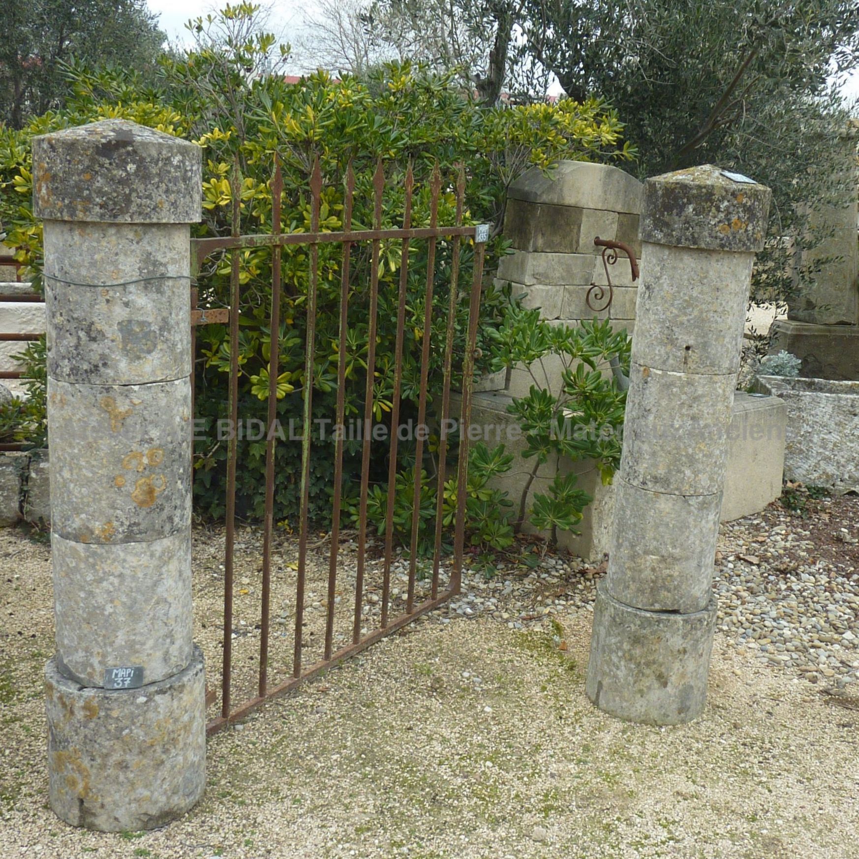 A old small stone pillar with a cylindrical shape- sold in set of 2.