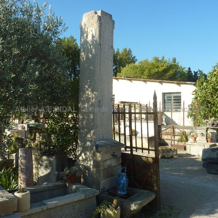 Old pillar in a rustic style- old pillar made of Cassis stone.