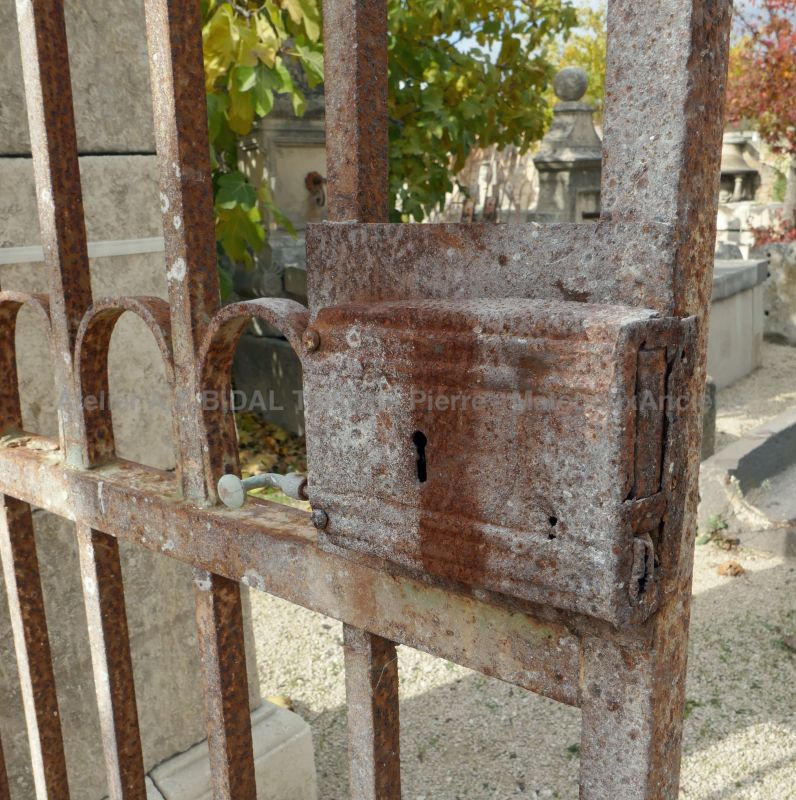 Fully open-worked old gate with 2 riveted wrought iron doors