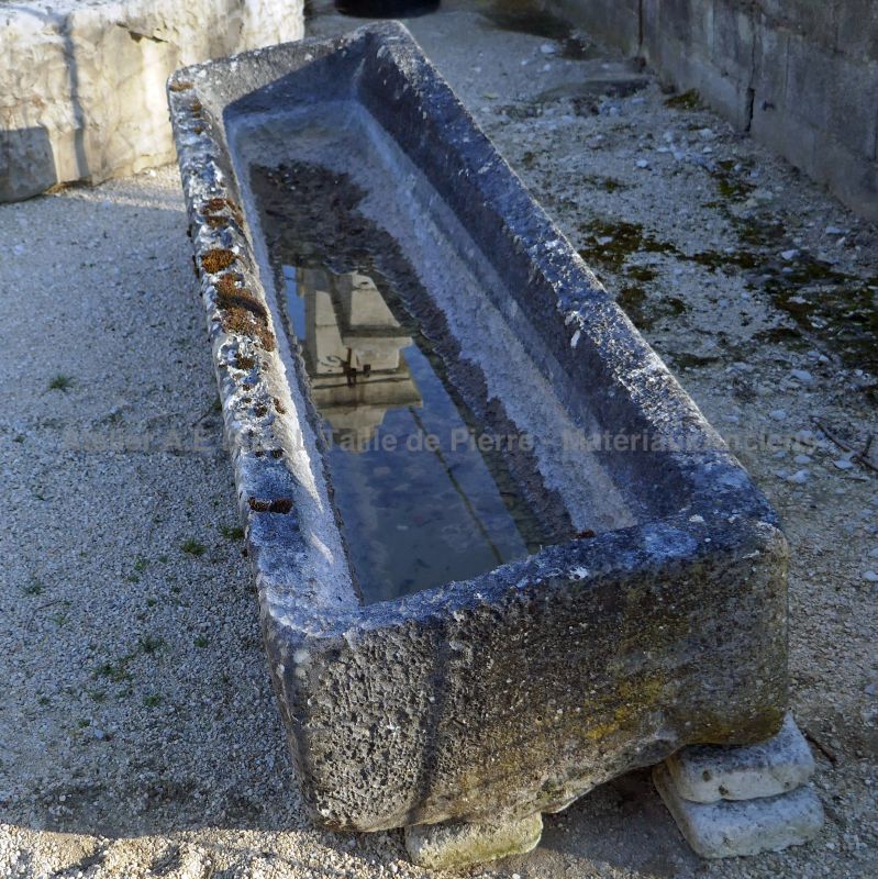 Long shallow trough in weathered stone : rustic stone trough