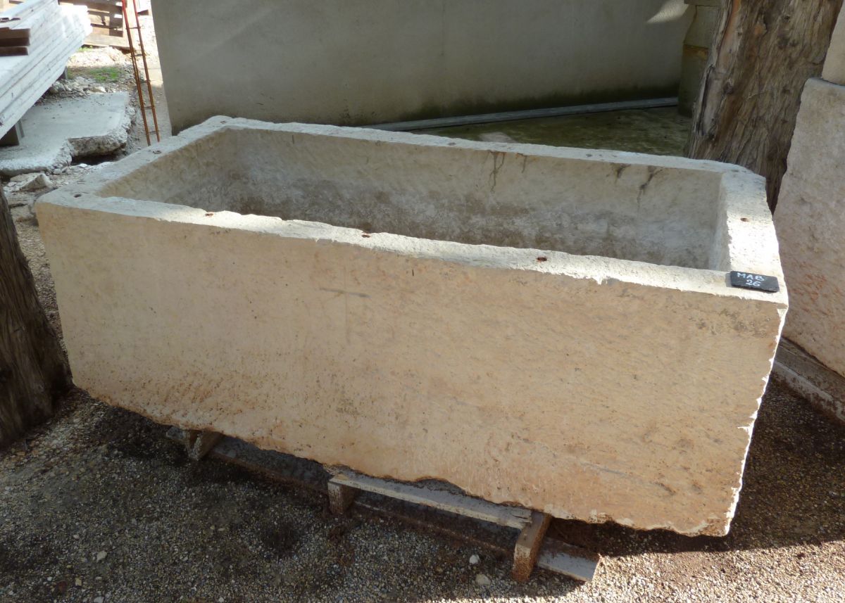 Old, large basin made of stone - a large rectangular basin.