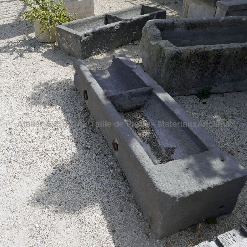 Long rectangular stone trough - old trough made of lava stone.