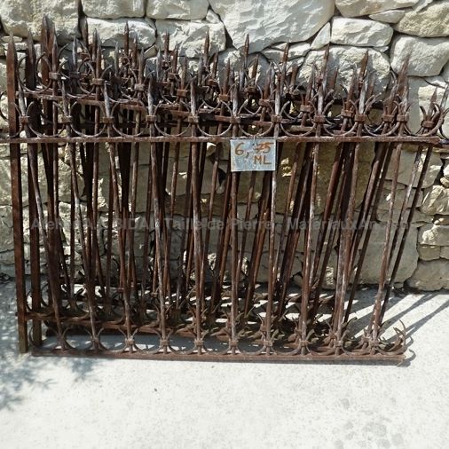 Old parapet made of wrought iron. Openwork / riveted iron parapet..