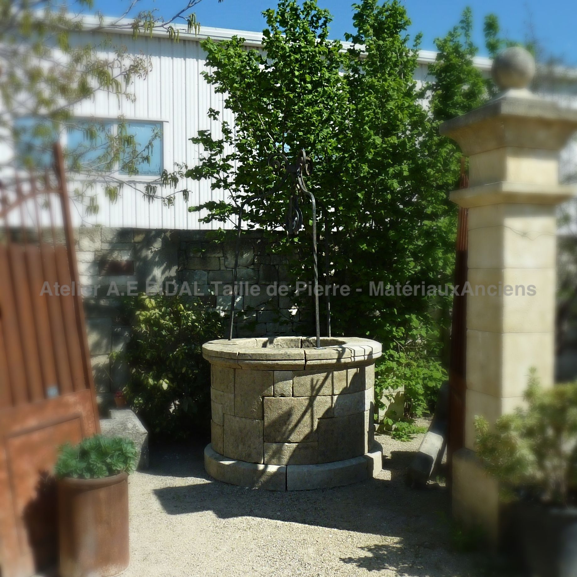 Round well with top. Set of wells made of old materials.