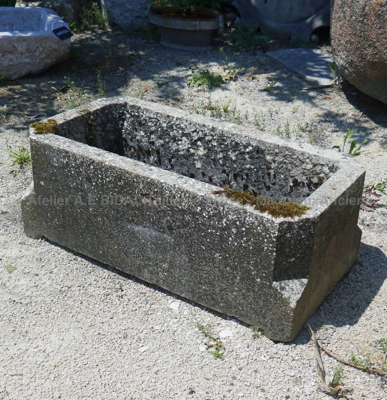 Authentic and charming planter in old patinated natural stone