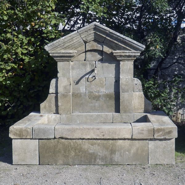Wall fountain with half-moon basin and beautiful hand sculpted dolphin