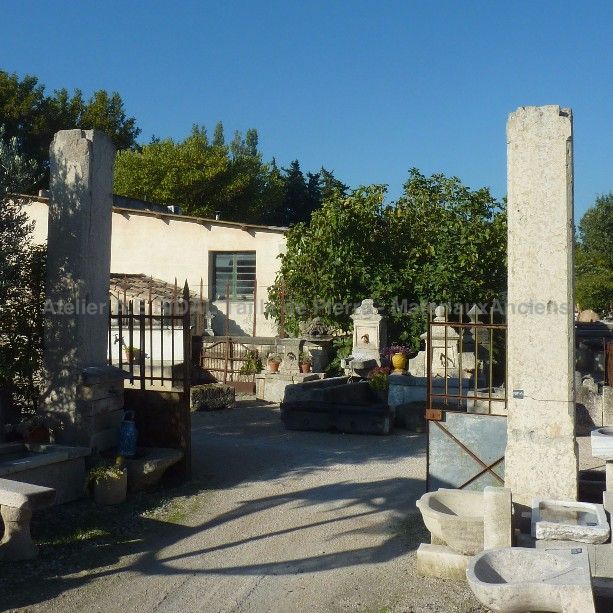 Old pillar in a rustic style- old pillar made of Cassis stone.