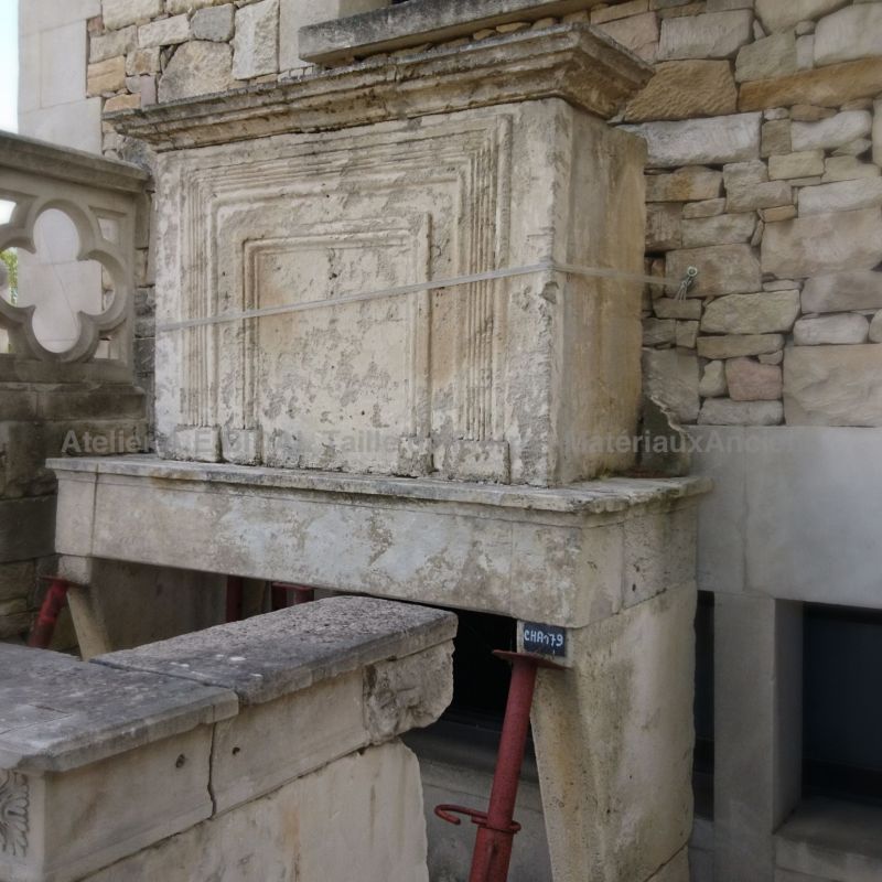 Antique French stone fireplace - A 17th century fireplace with hood.