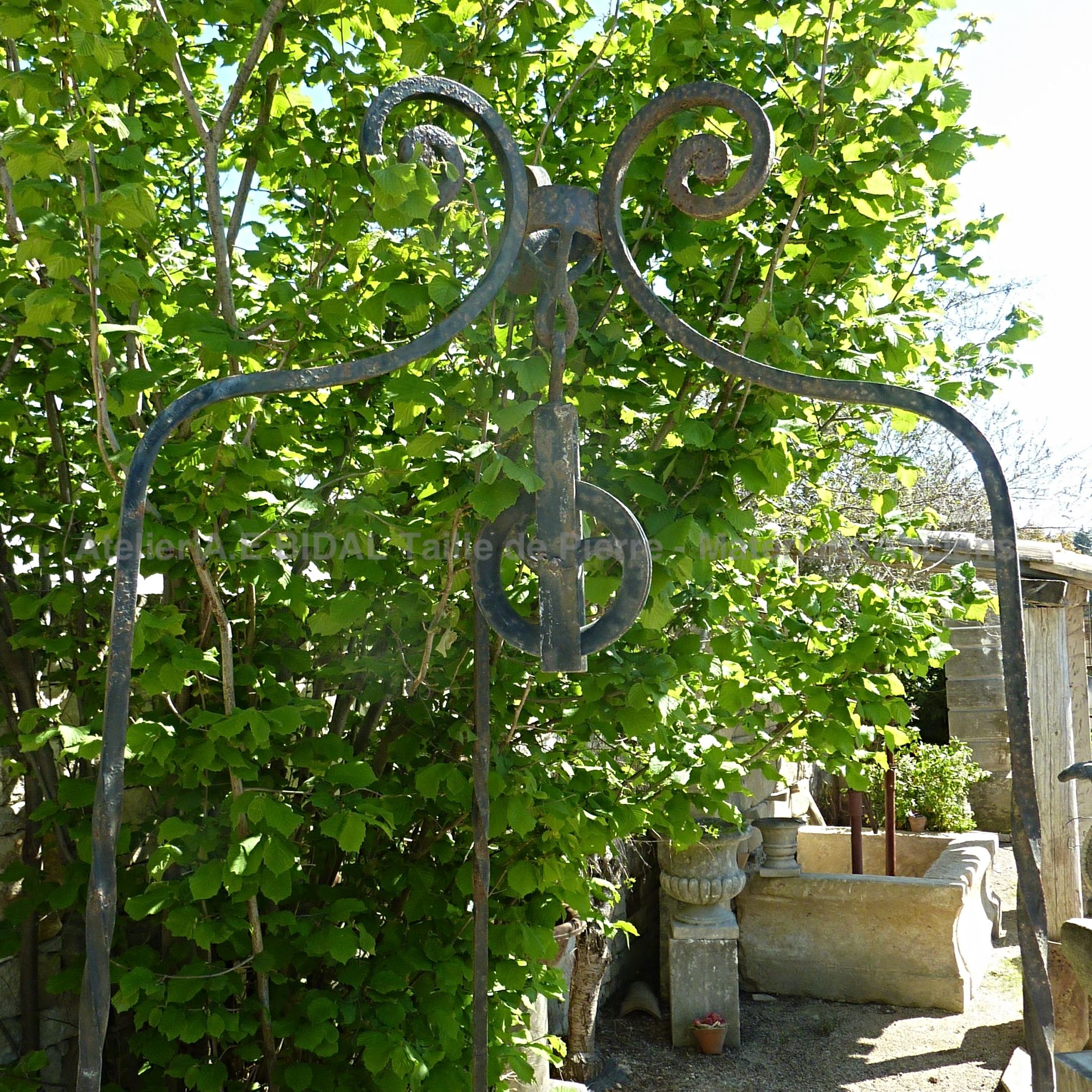 Round well with top. Set of wells made of old materials.
