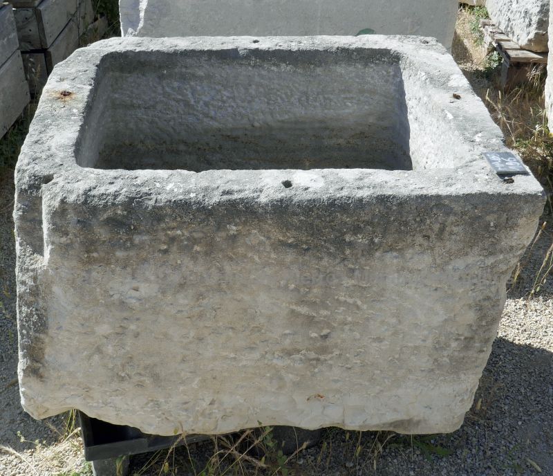 Old stone trough made in Provence. Antique farmer's trough in stone.