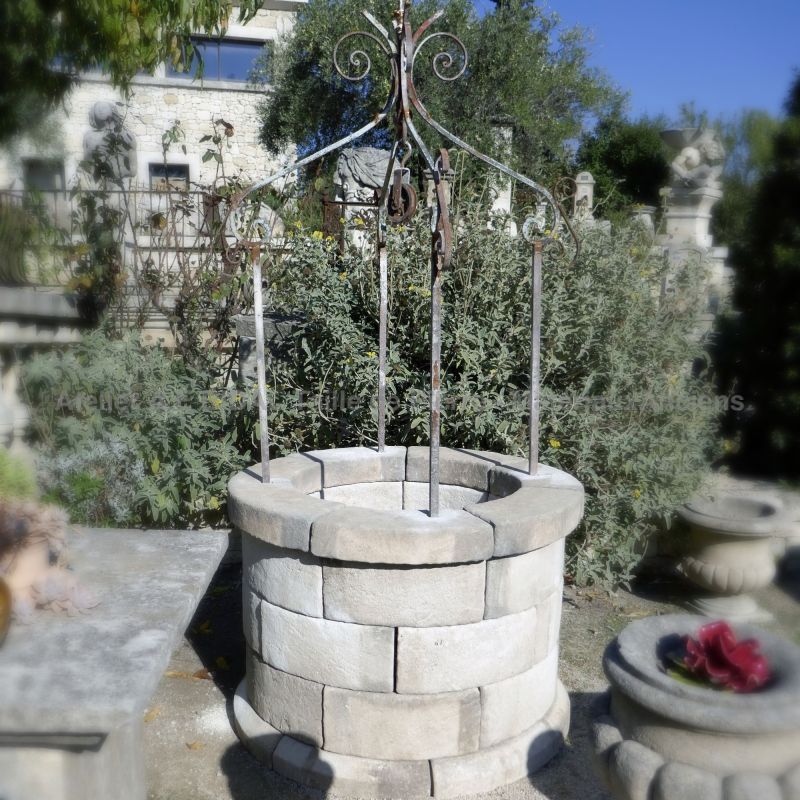 Garden decoration : round well in stone and its wrought iron structure