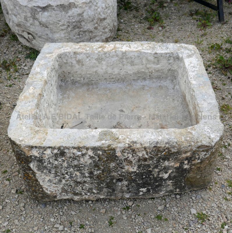 Rustic-looking small trough in stone - shallow rectangular trough