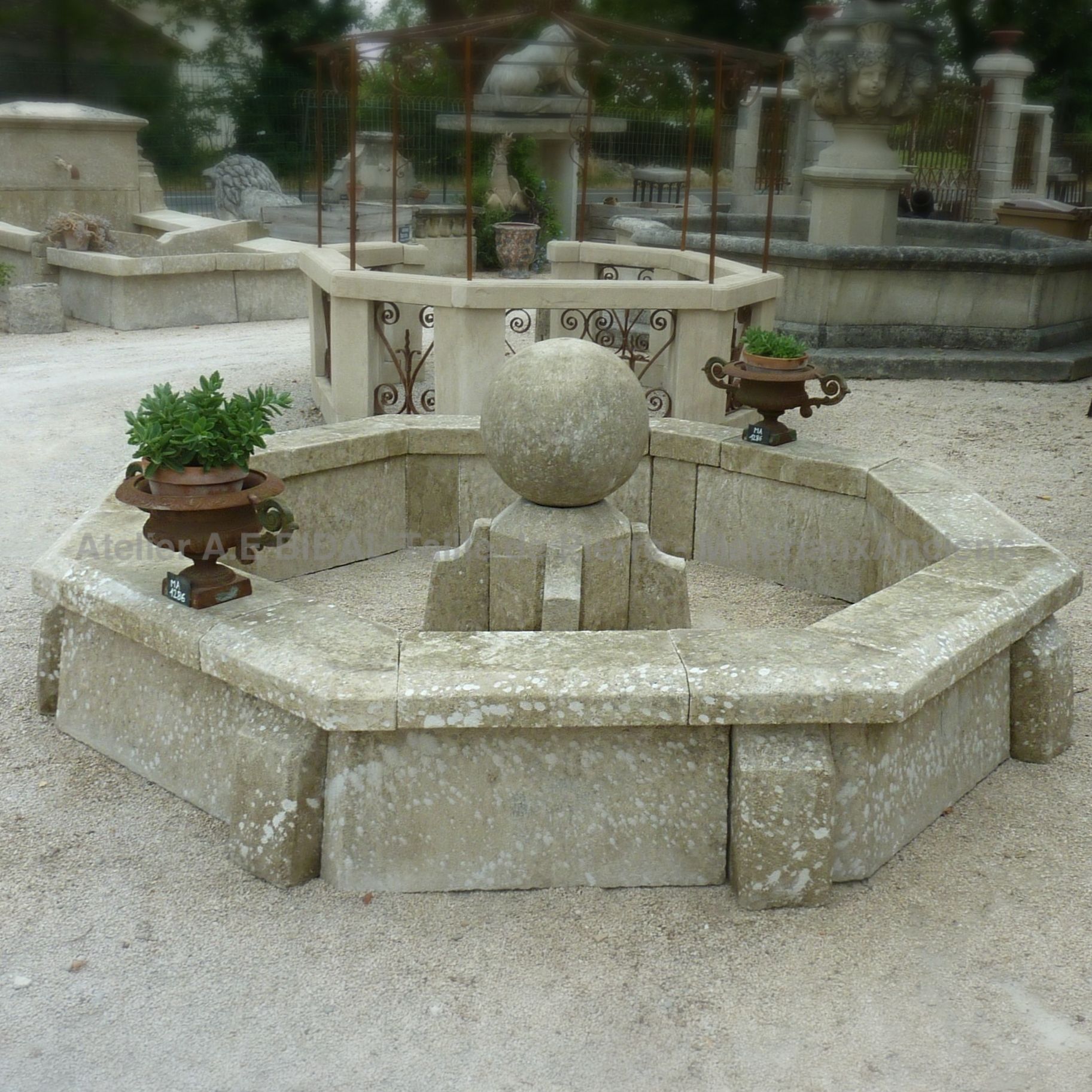 For the layout of your garden, elegant ancient stone basin with ball
