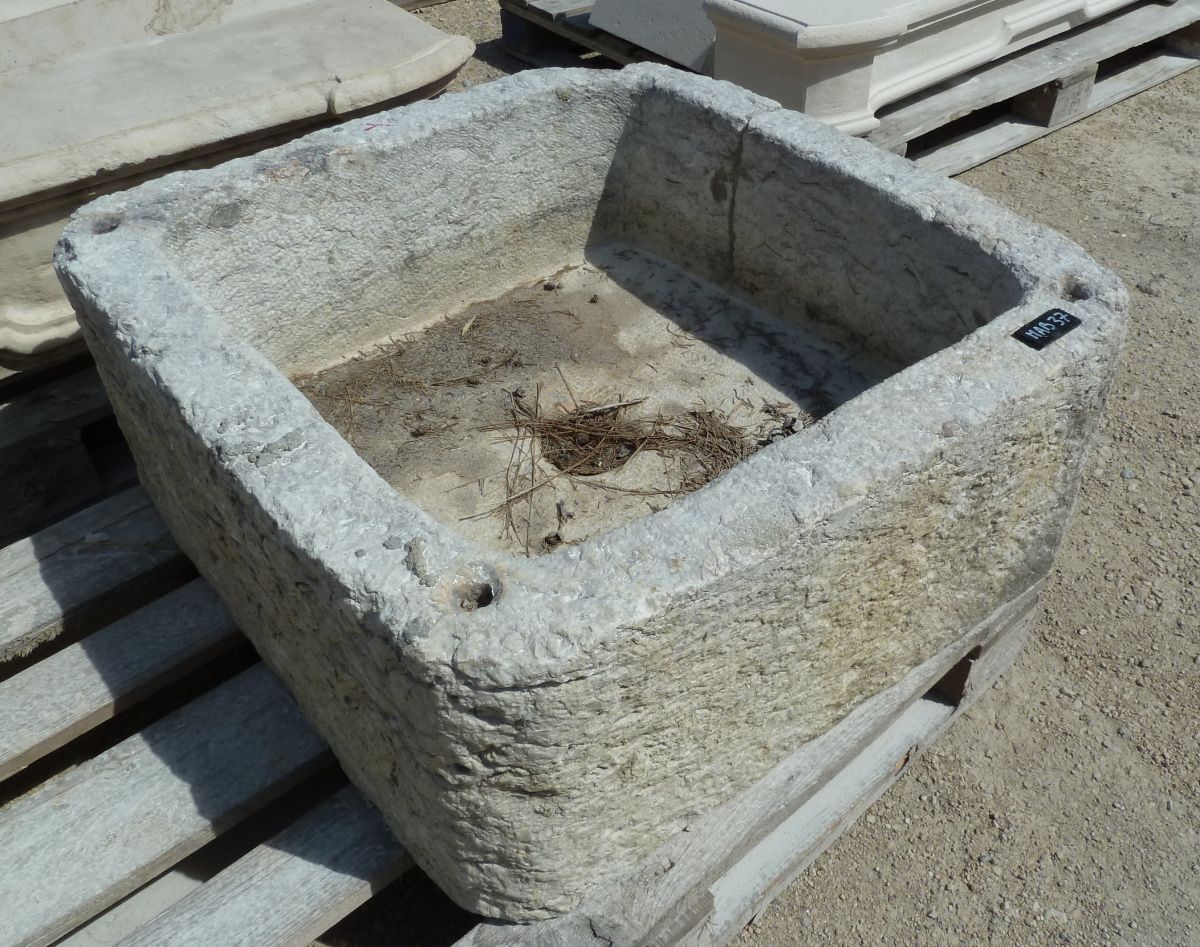 Old stone basin in a square shape - beautiful old stone basin.